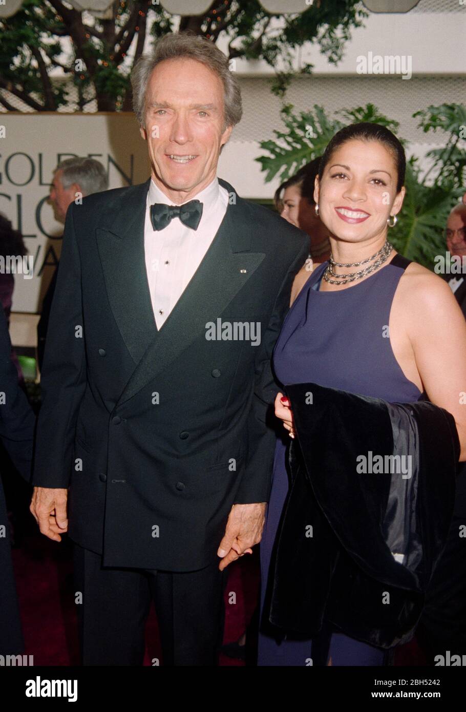 LOS ANGELES, CA. c.1995: Actor/director Clint Eastwood & Dina Ruiz. File photo © Paul Smith ...