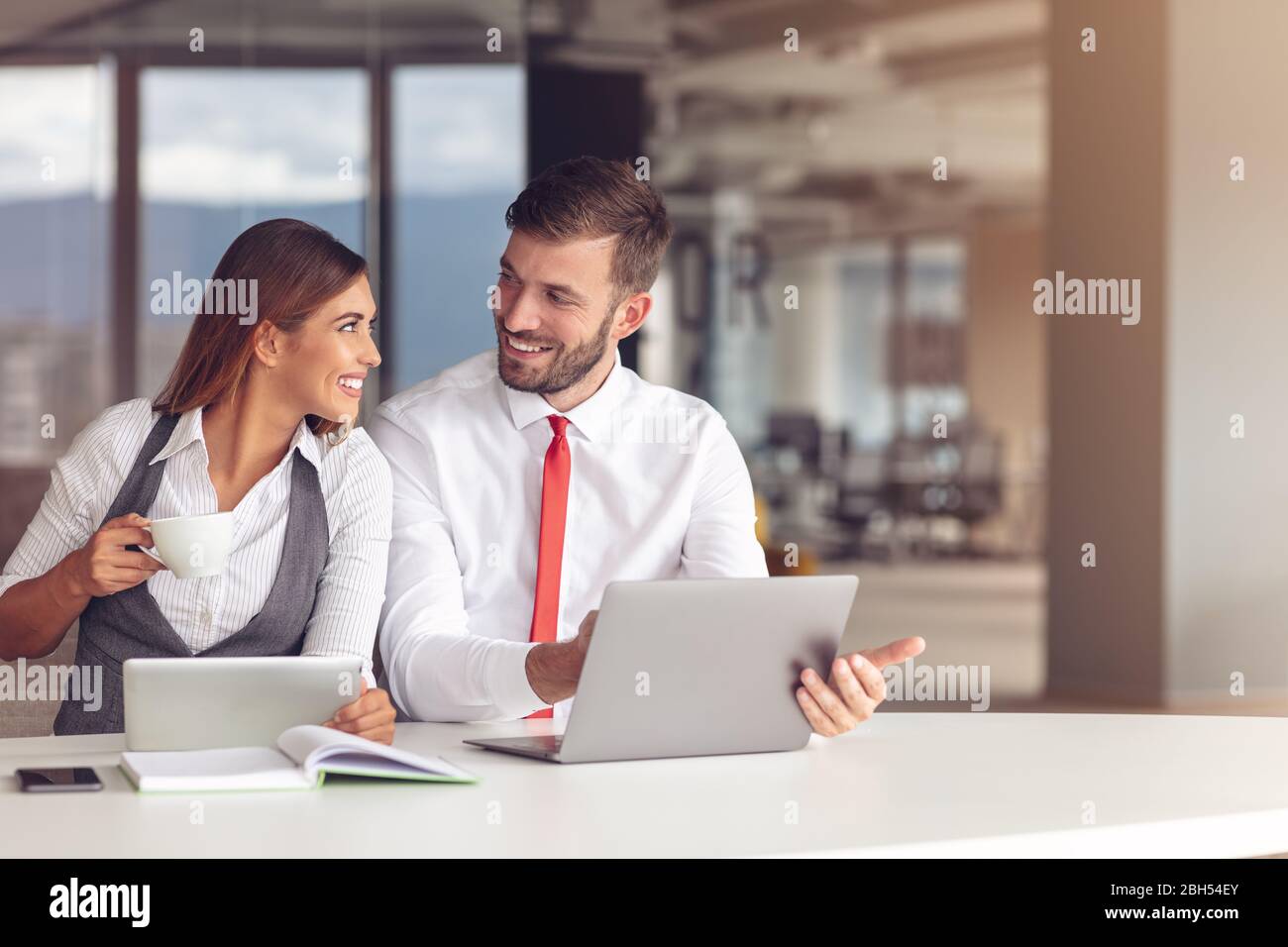 Young Business people working together on computer Stock Photo - Alamy