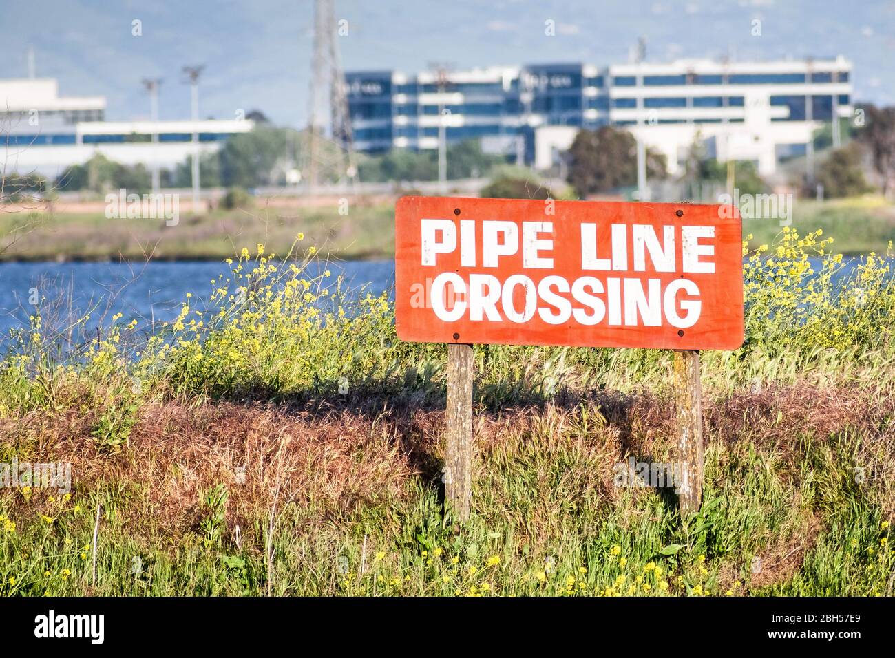Pipe Line Crossing warning sign posted on the shoreline of South San ...