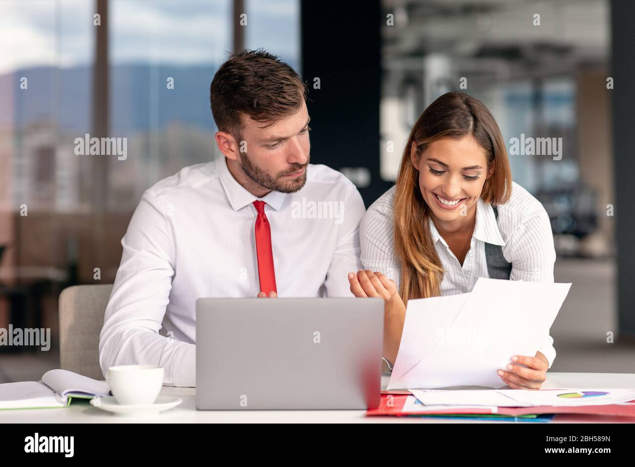 Young Business people working together on computer Stock Photo - Alamy