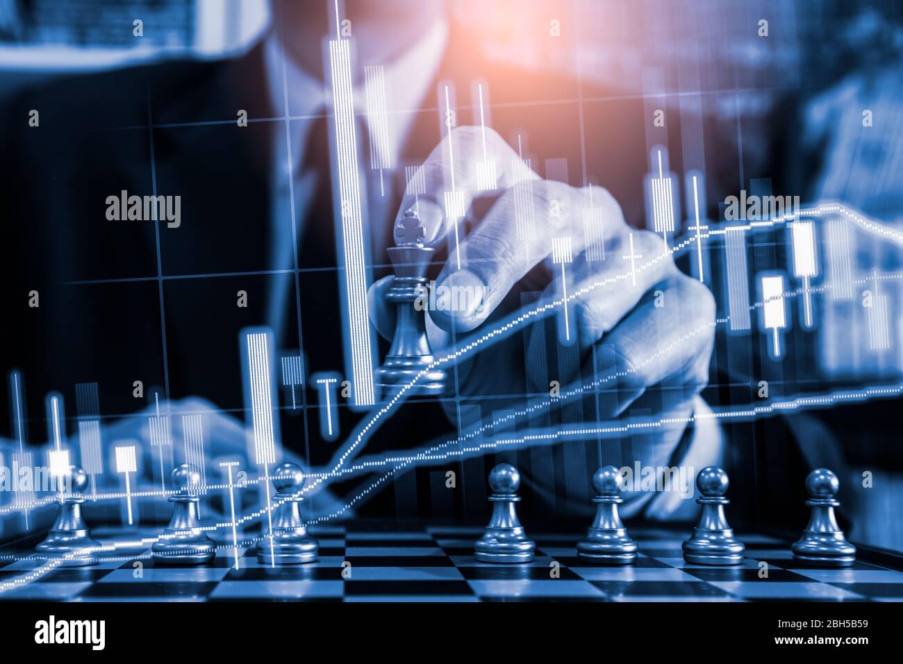 Chess game on chess board on stock market or forex trading graph chart ...