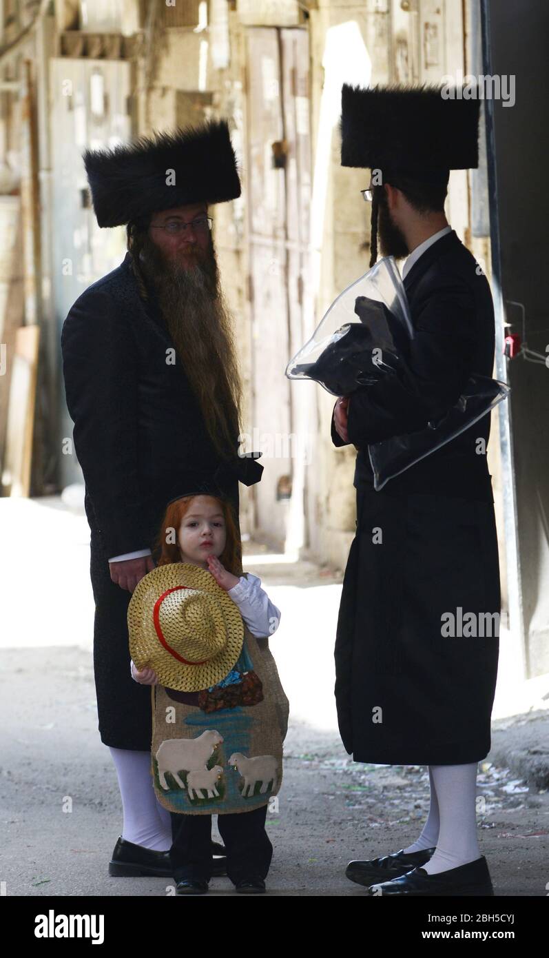 Hasidic boys wearing costumes for the Purim festival in the Mea Shearim ...