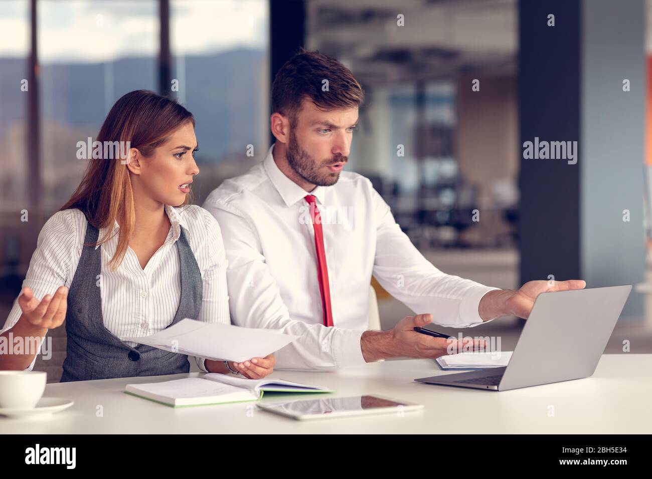 Young Business people working together on computer Stock Photo - Alamy