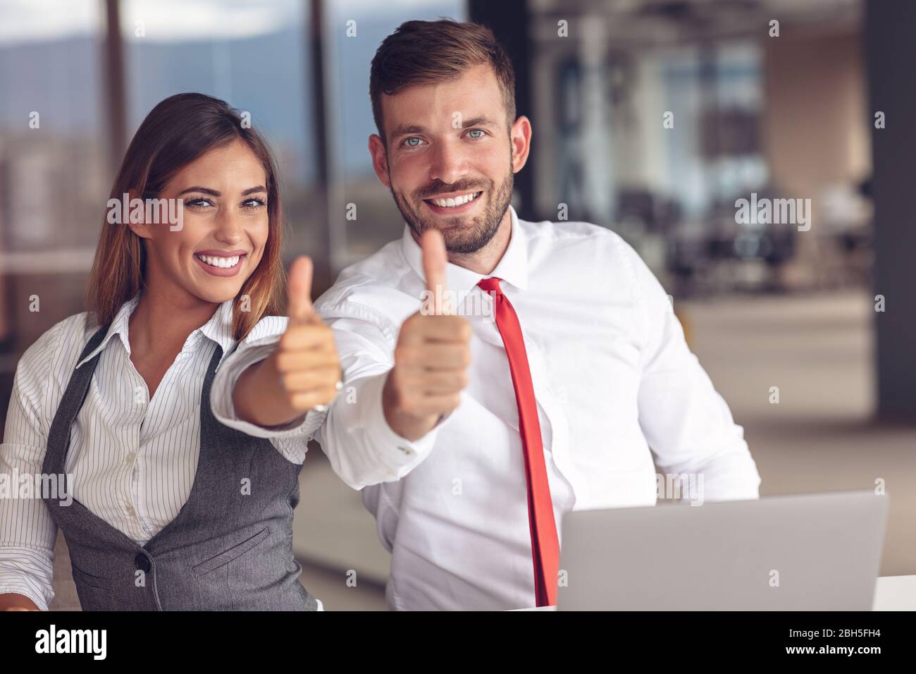 Young Business people working together on computer Stock Photo - Alamy