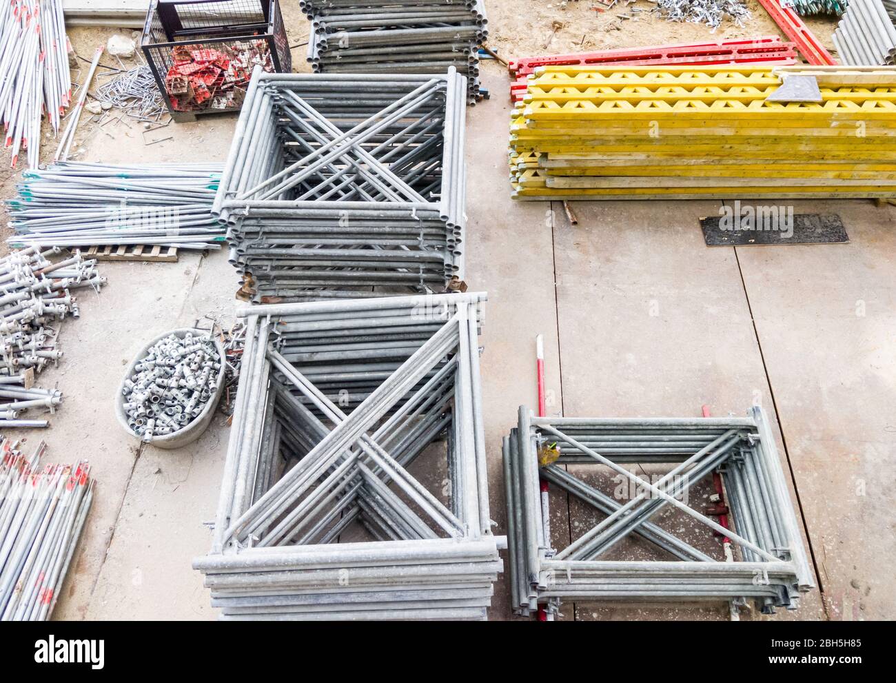 Group of the metal frame and equipment pile on the concrete ground ...