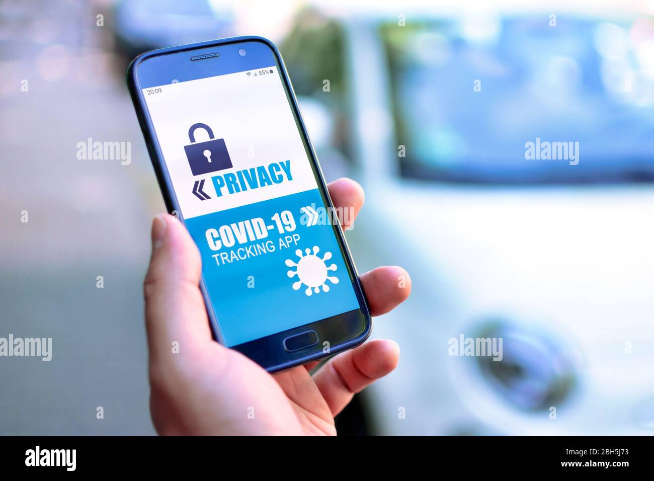 Privacy concerns with Corona Virus Tracking App concept showing hand ...