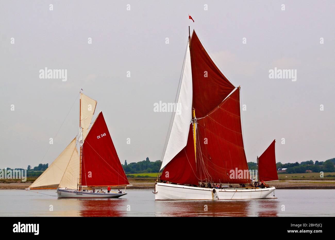 Two traditional sailing craft, the Thames sailing barge Niagara with ...