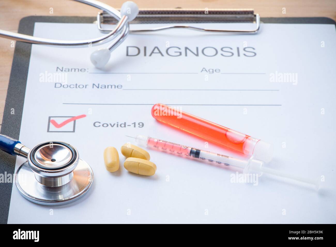 Positive diagnosis Coronavirus disease 2019 or COVID-19 on doctor desk ...