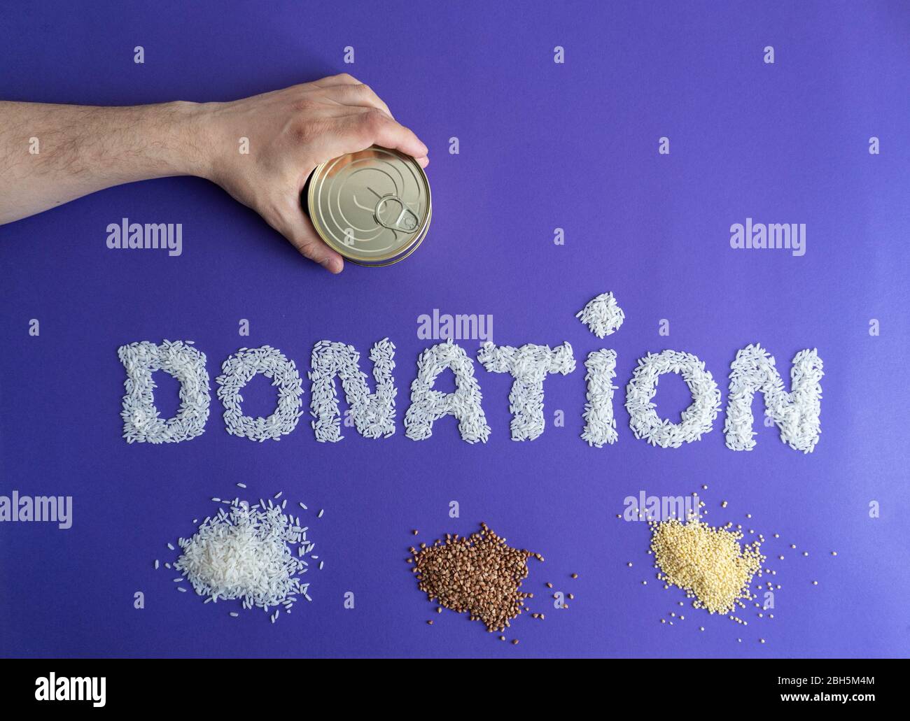 Closeup of word donation on purple background Stock Photo - Alamy