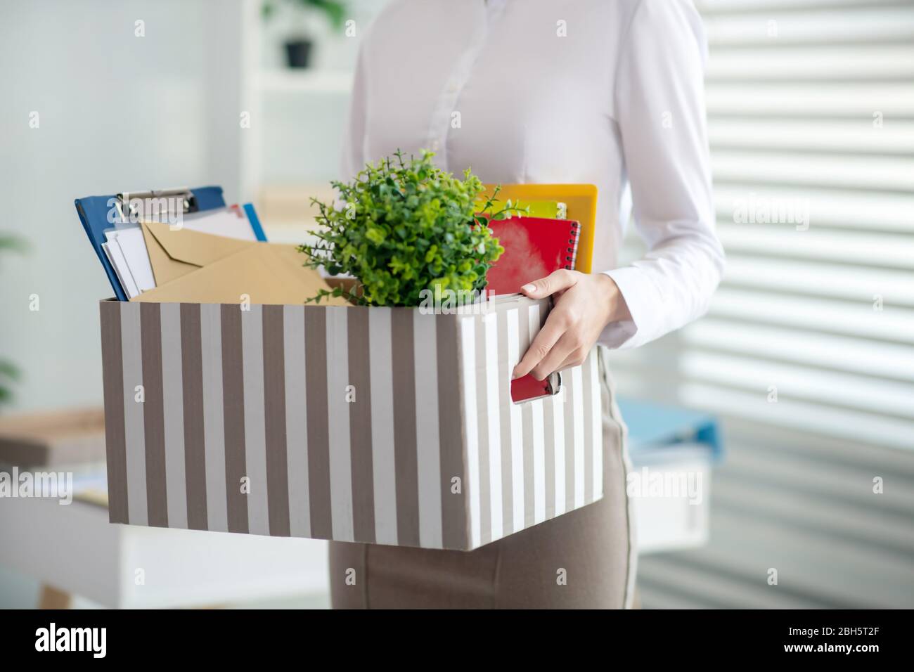 Leaving work carrying box hi-res stock photography and images - Alamy