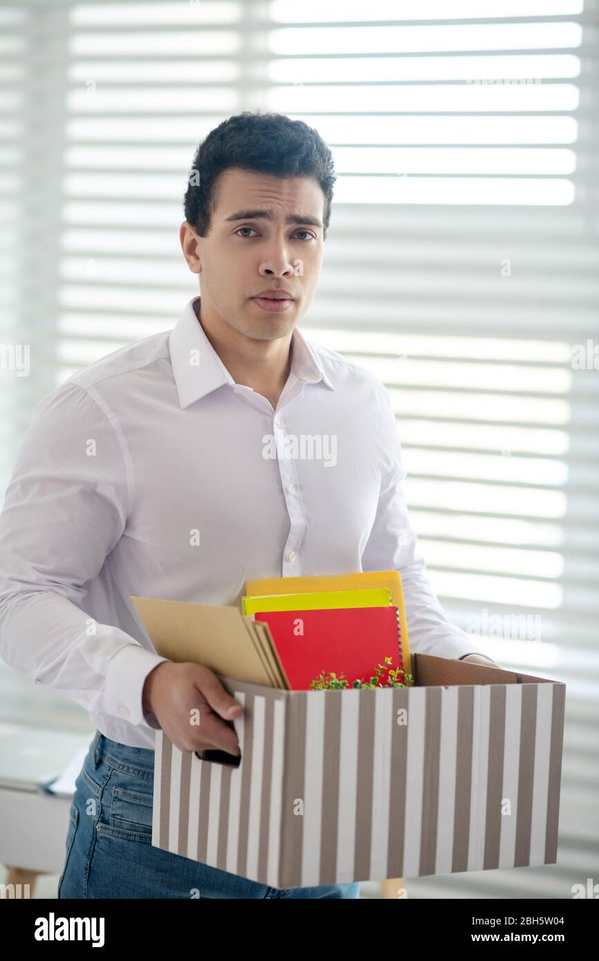 Man carrying box of personal hi-res stock photography and images - Alamy