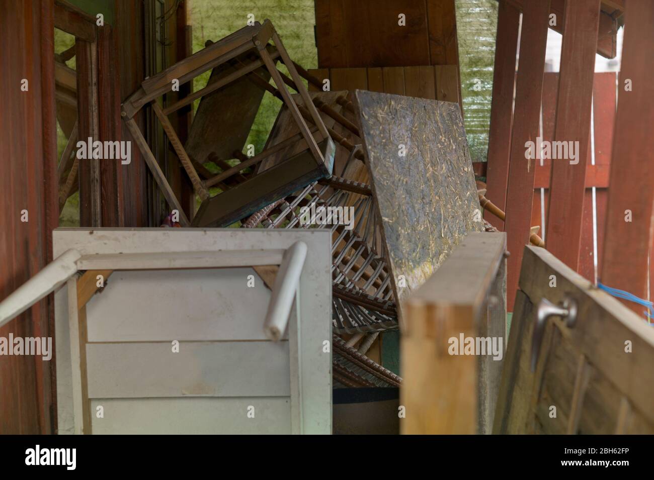 Collection of old discarded furniture in a storage room Stock Photo - Alamy