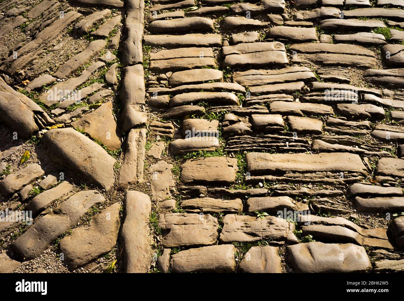 Old road pavement with layed stones from medieval times Stock Photo - Alamy
