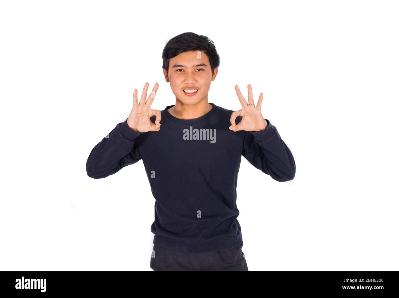The photo of A Thai man is showing an OK sign by his two hands Stock ...