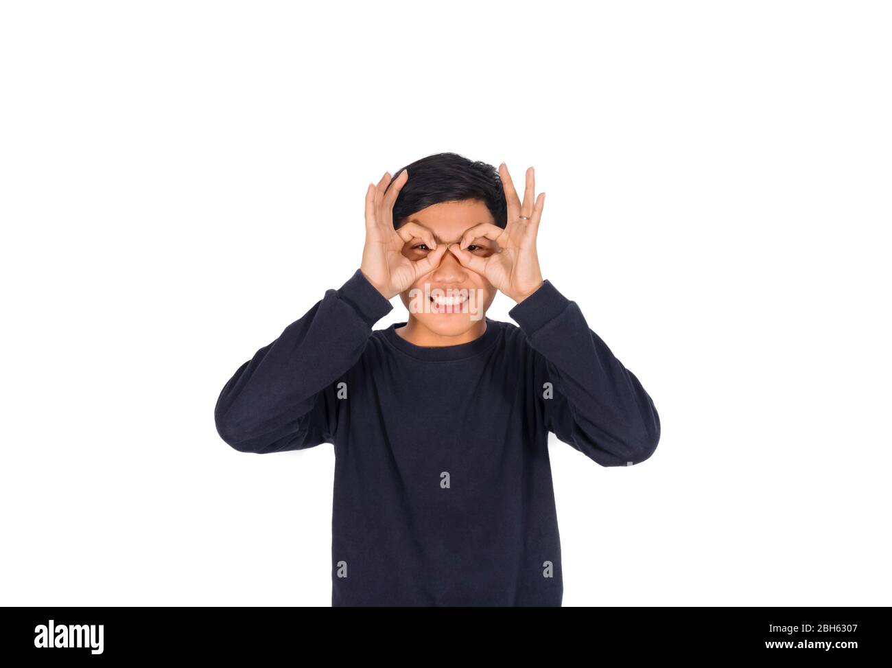 The photo of A Thai man is mocking an owl lake the OK signs by his two ...