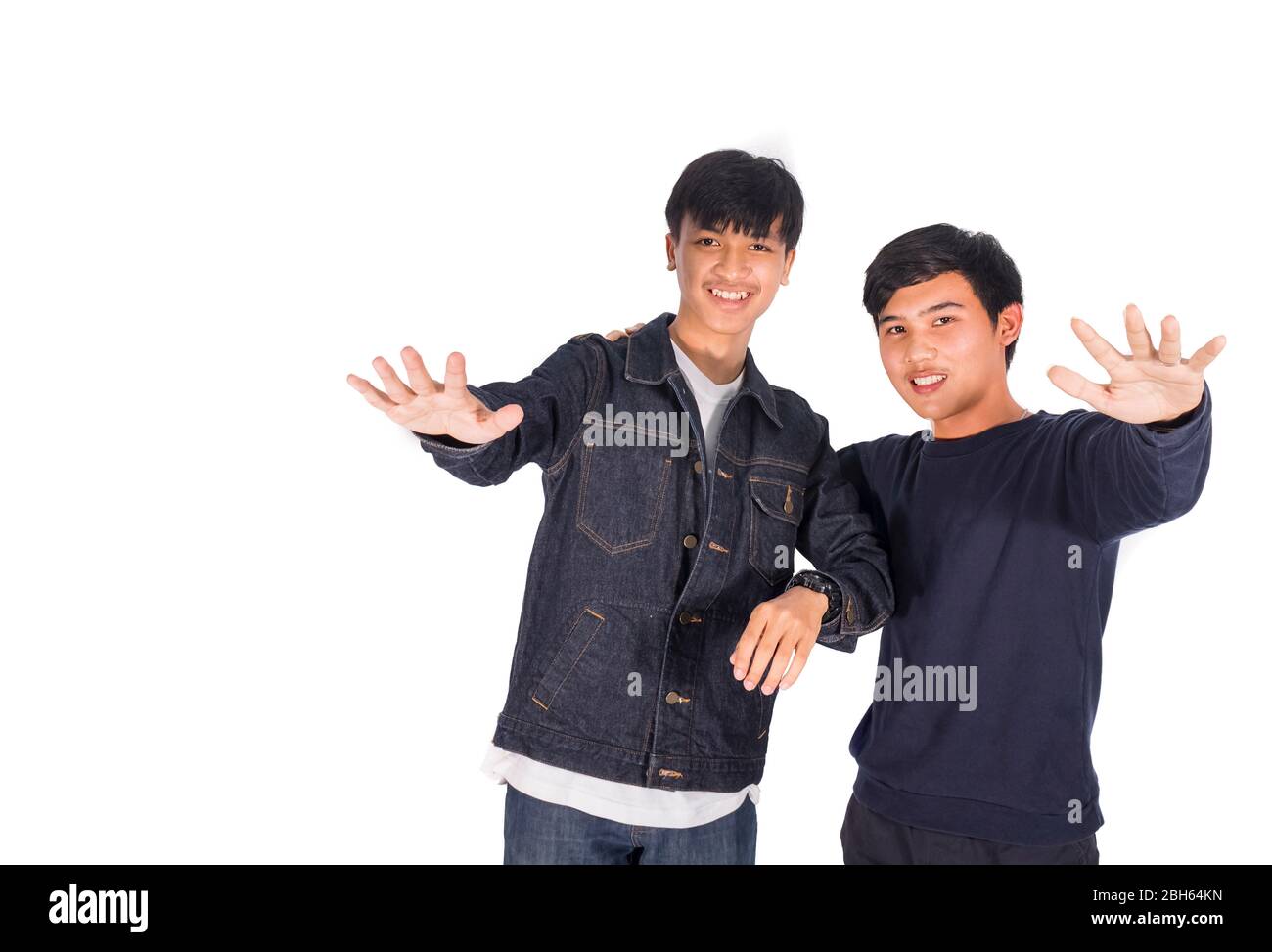 Two Thai boys show hand saying goodbye isolation Stock Photo - Alamy