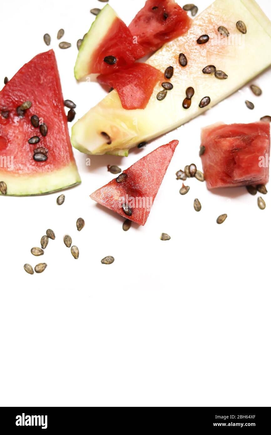 Watermelon slices with bits and seeds on white background Stock Photo ...