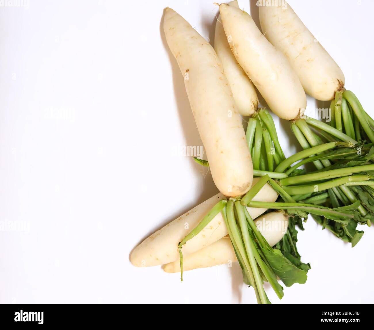fresh white radish isolated on white backgrounds Stock Photo - Alamy