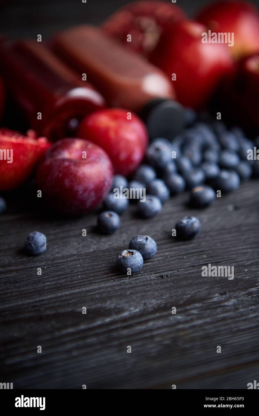 Mix of fresh red and black fruits. With botteled fresh juices Stock ...