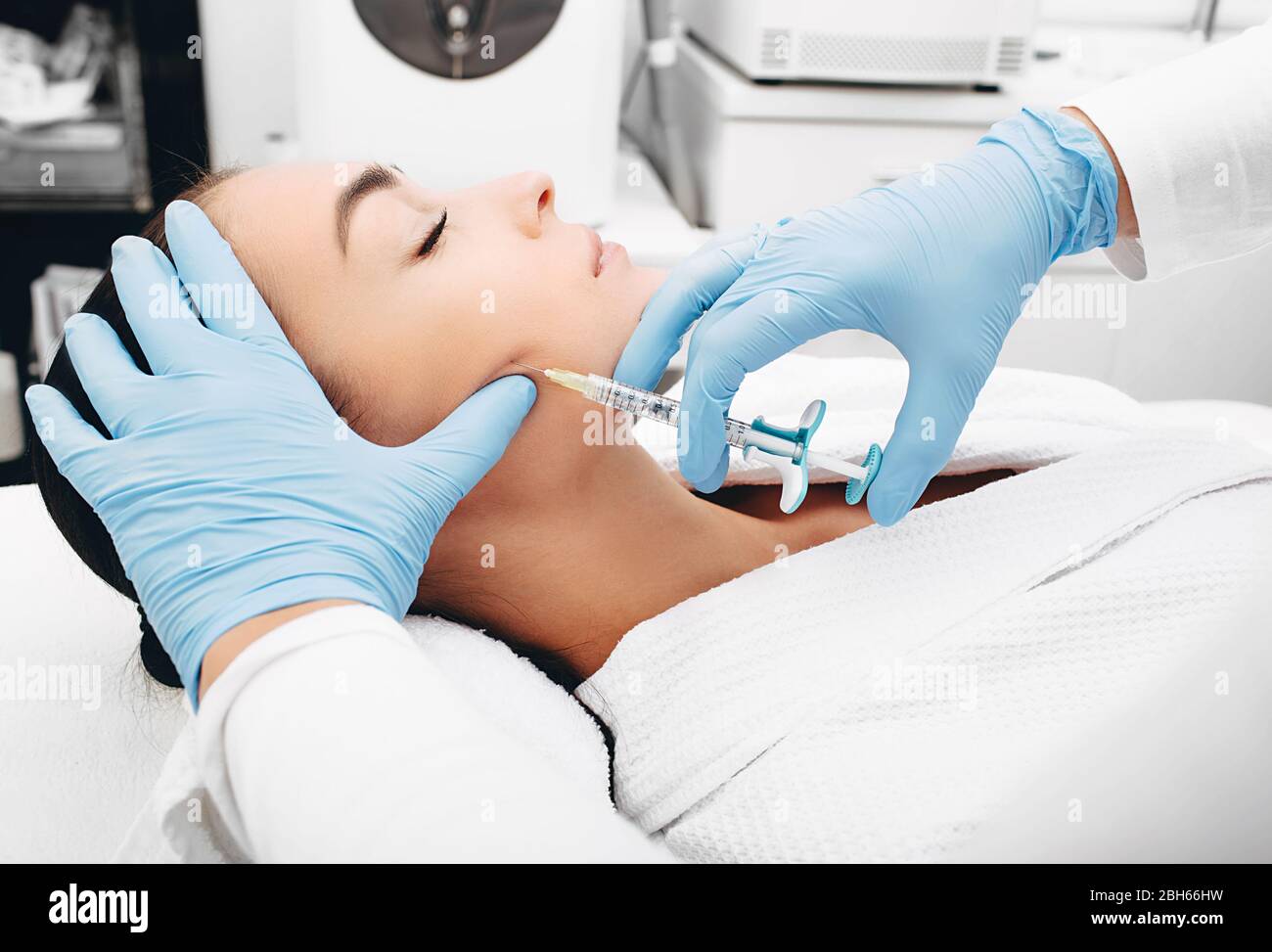 woman having facial injections for facelift and anti-aging effect Stock ...