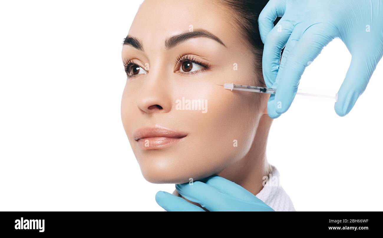 Beautiful woman during facial rejuvenation procedure. Anti-aging ...