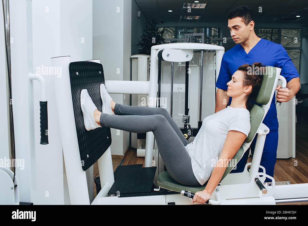 rehabilitation specialist help doing patient's physical exercises at ...