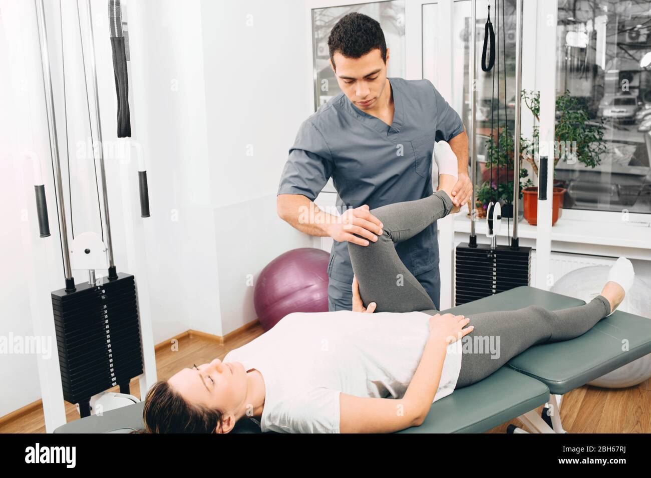 doctor checks the condition of the woman's legs after treatment. Female ...