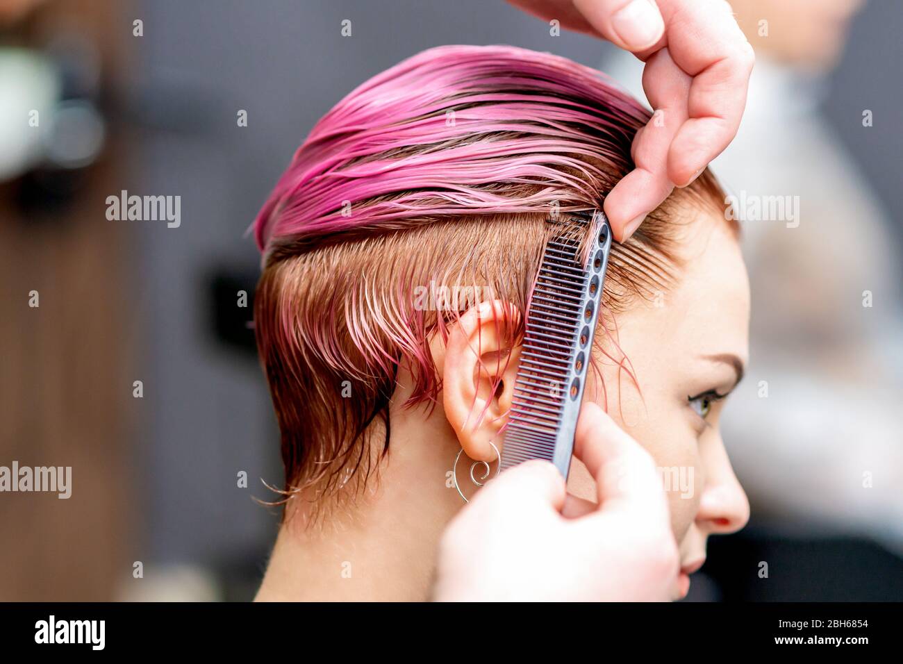 Woman combing hair fingers hi-res stock photography and images - Alamy