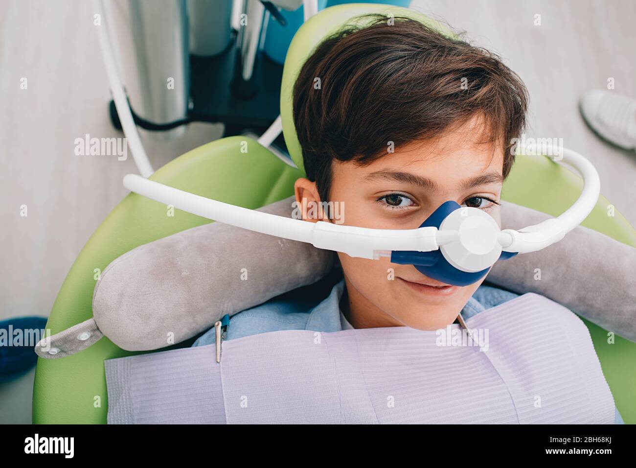 Little boy getting Inhalation Sedation while teeth treatment at dental ...