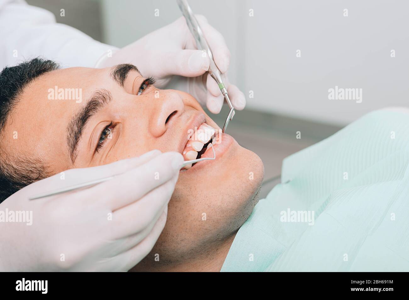 African american man check up teeth with dental equipment Stock Photo ...