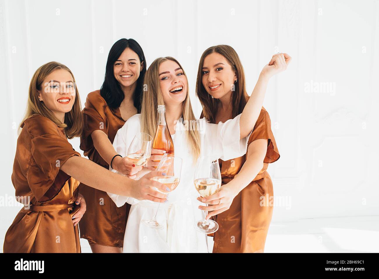 Pajamas party time. Beautiful charming girlfriends celebrating hen ...