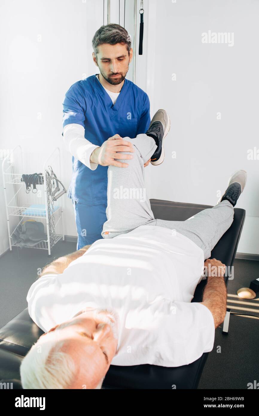 Senior man training therapist hi-res stock photography and images - Alamy