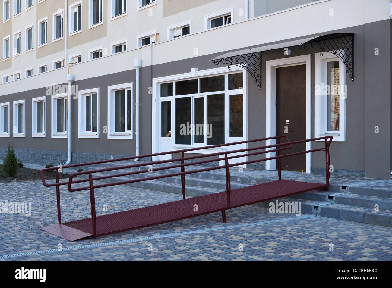 Wheelchair access ramp for entrance of residential multistory building ...