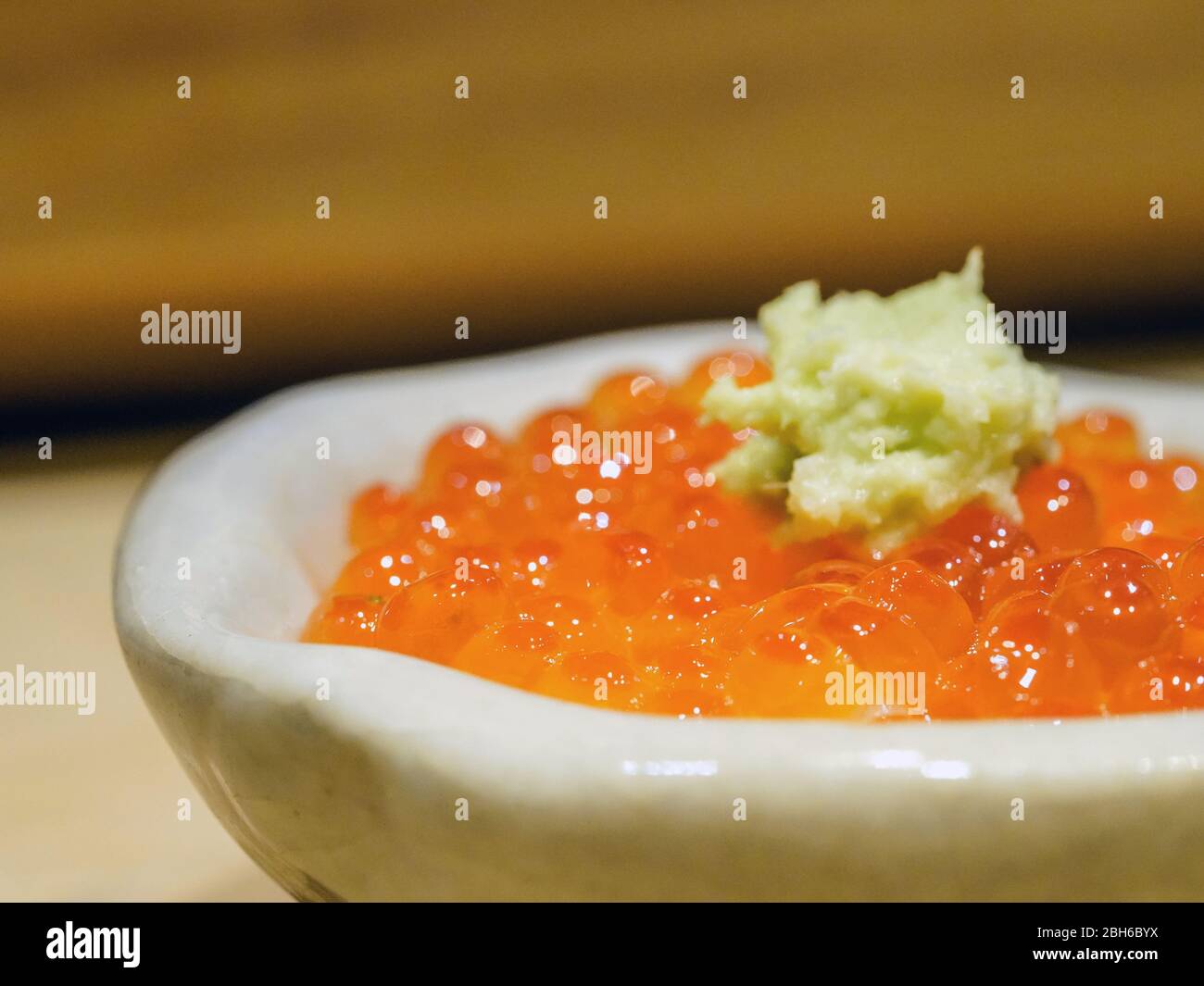 Salmon roe (ikura) with fresh wasabi on the rice bowl. Enjoy Omakase ...