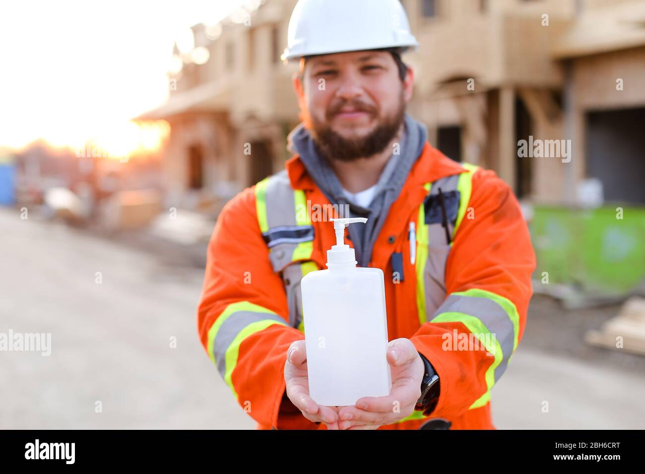 Focus on disinfectant soap given by engineer at construction site Stock ...