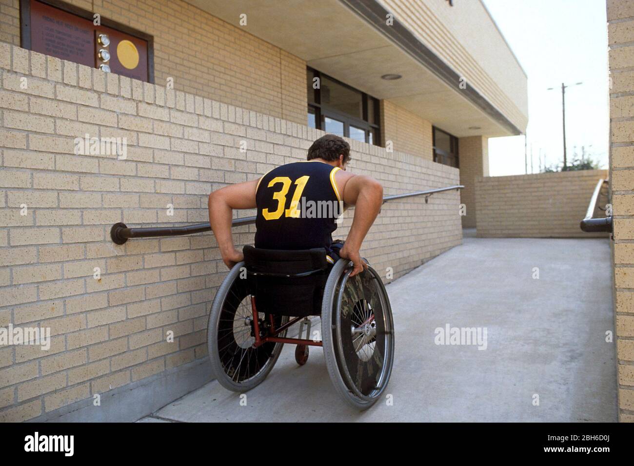 Austin Texas USA: Disabled male athlete goes up wheelchair ramp at ...