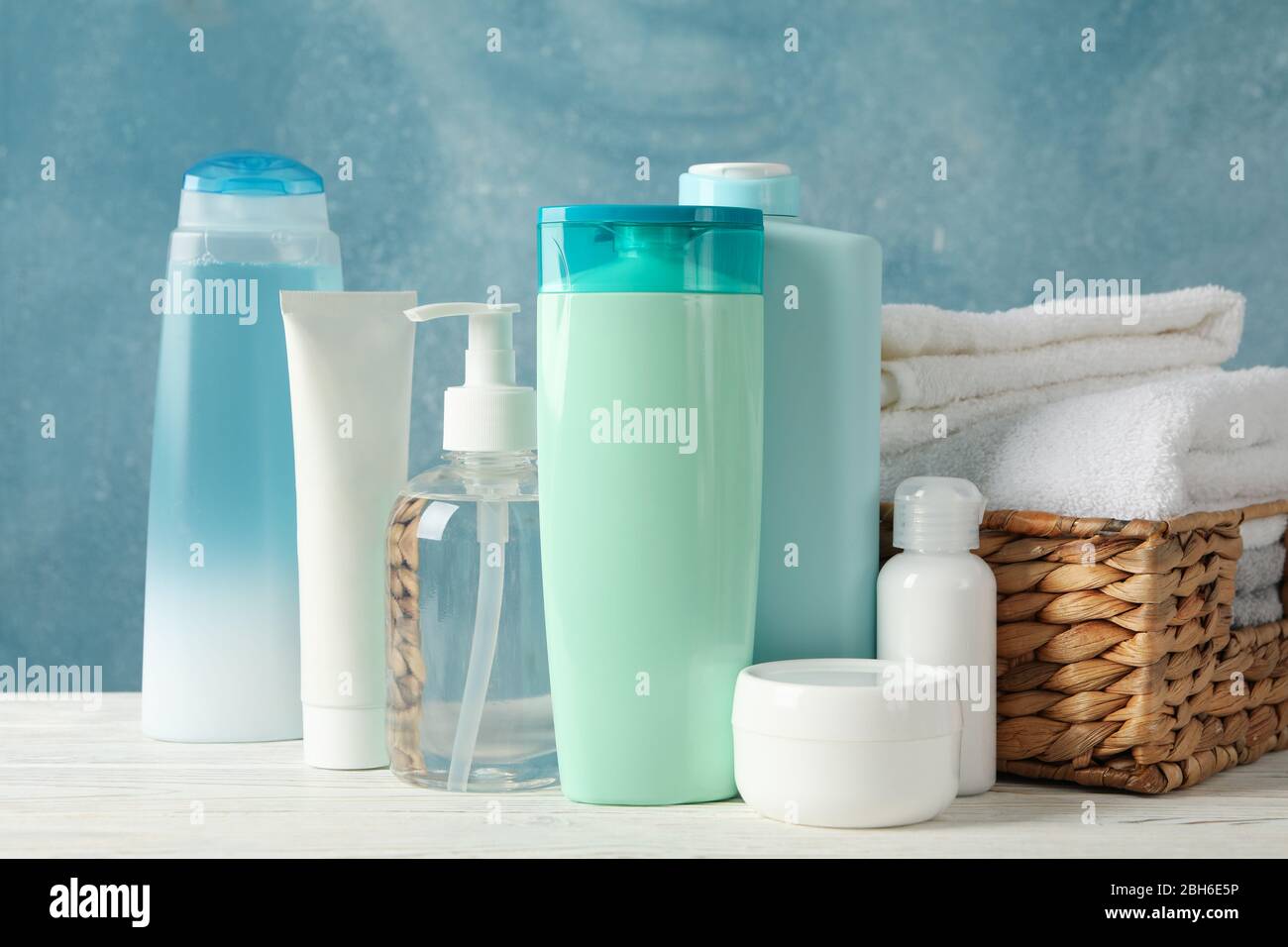 Body care products on blue background. Personal hygiene Stock Photo - Alamy