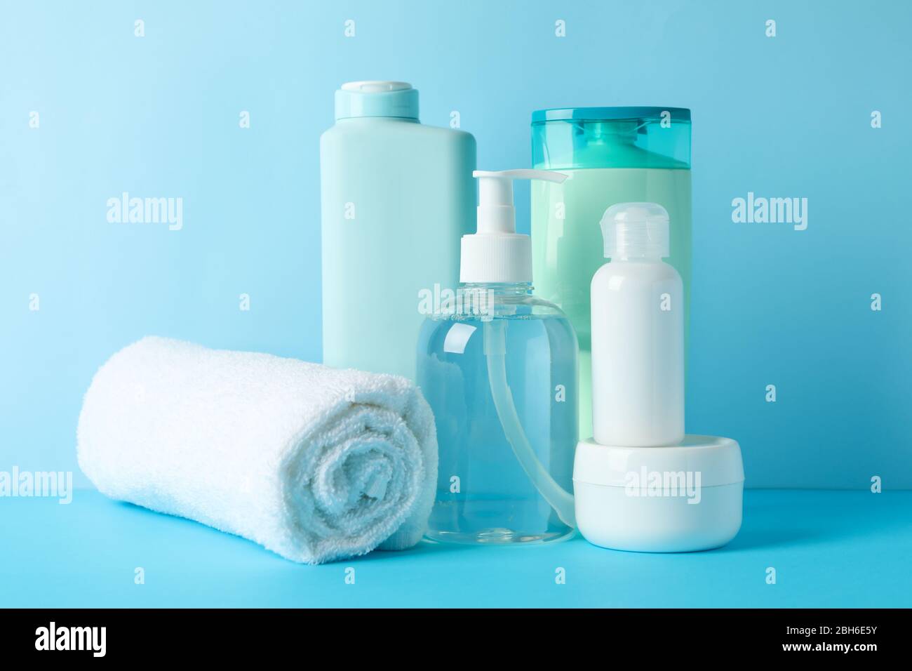 Body care products on blue background. Personal hygiene Stock Photo - Alamy