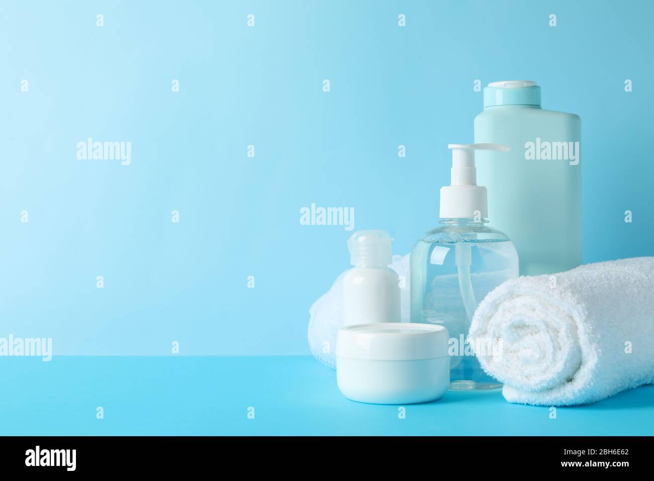 Body care products on blue background. Personal hygiene Stock Photo - Alamy