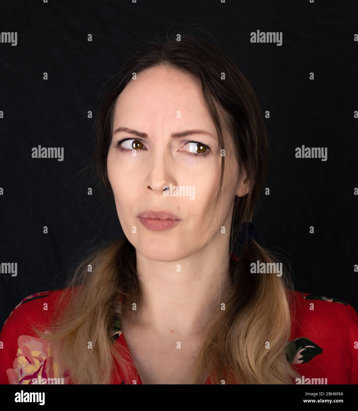 Emotion. perplexity Closed portrait of woman face with facial ...