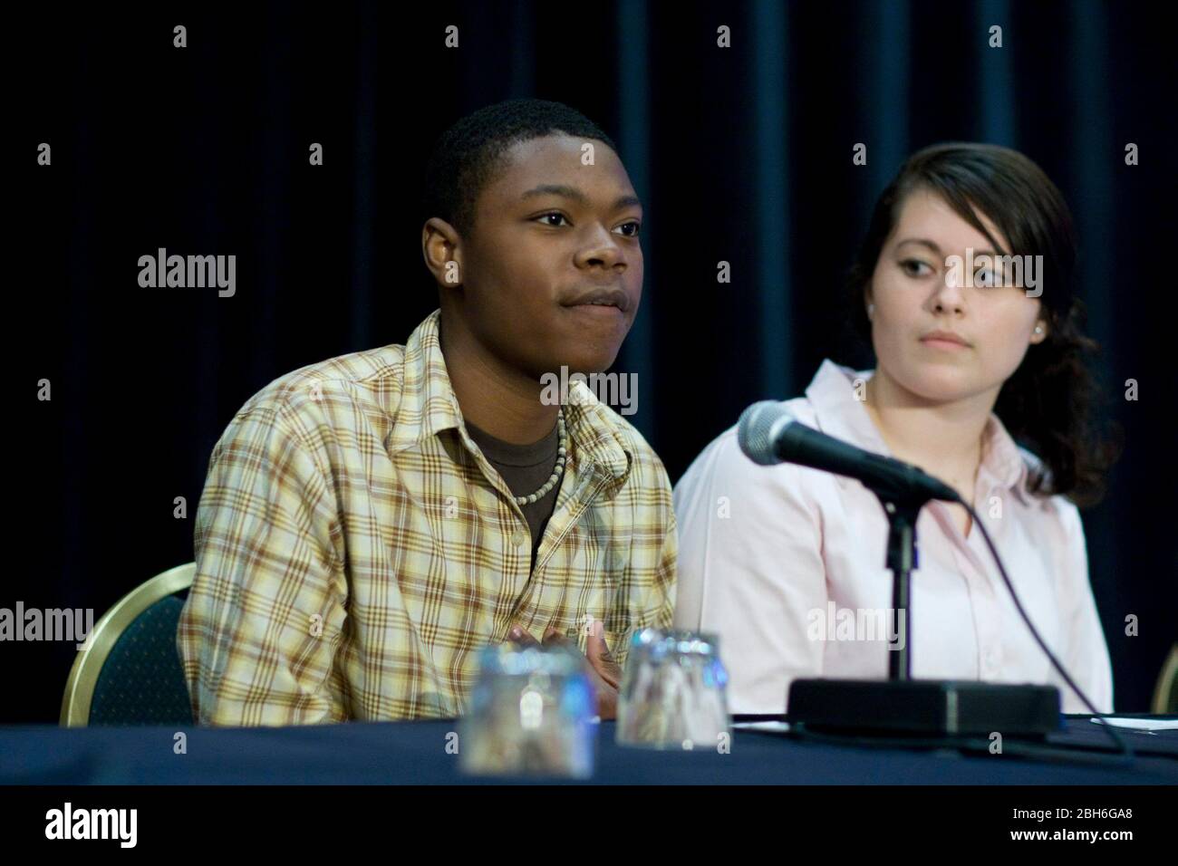 Black teen speaking into microphone hi-res stock photography and images ...