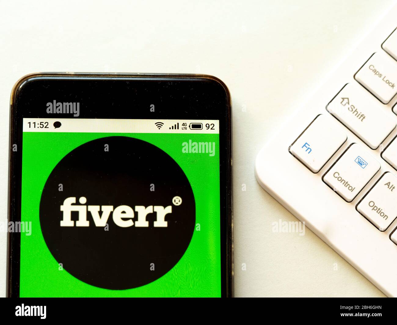 In this photo illustration Fiverr logo is seen displayed on a ...