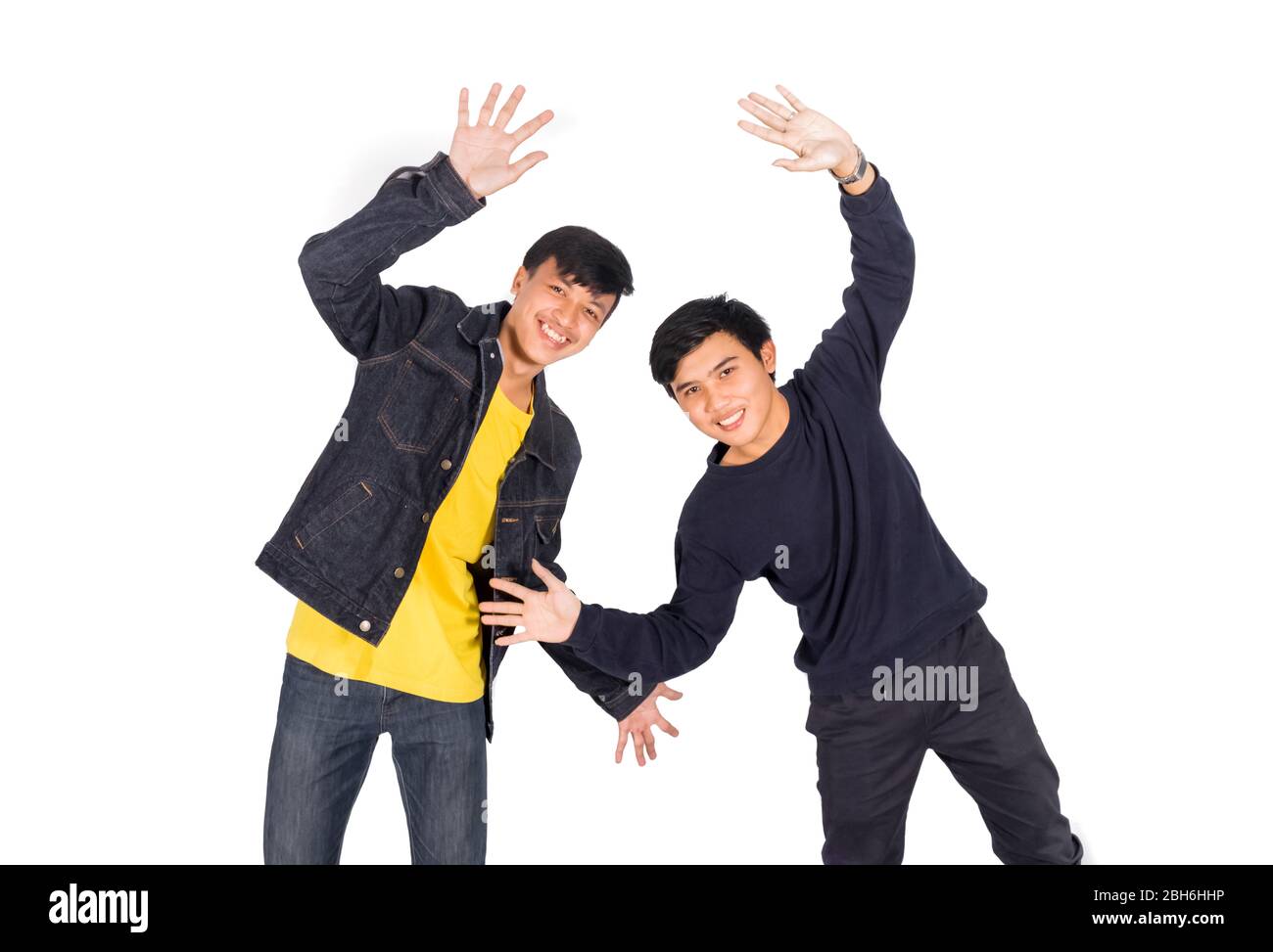 The photo of Two Asian friends men are waving their hands white ...