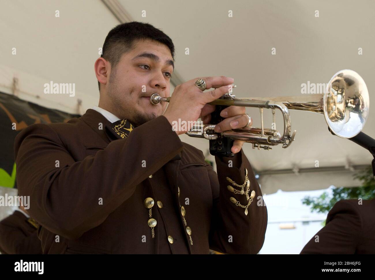 Austin Texas USA, 2009: Young trumpet player in traditional Mexican ...