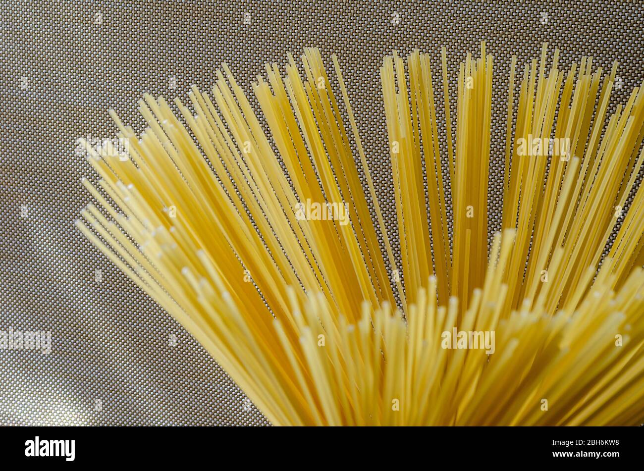 Spaghetti on a beige background. A bunch of spaghetti close-up. Group ...