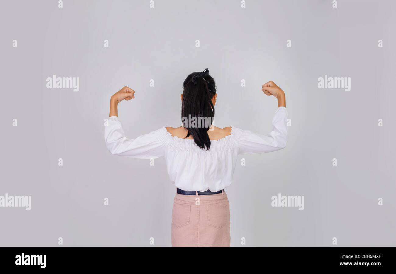 The backside of an Asian girl is pulling her bicep muscles Stock Photo ...