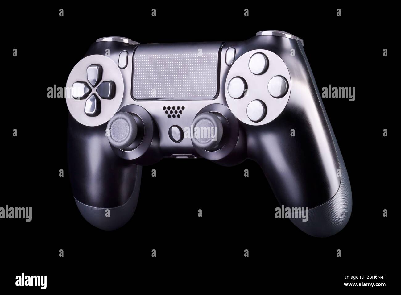 Black video game joystick gamepad isolated on a black background with ...