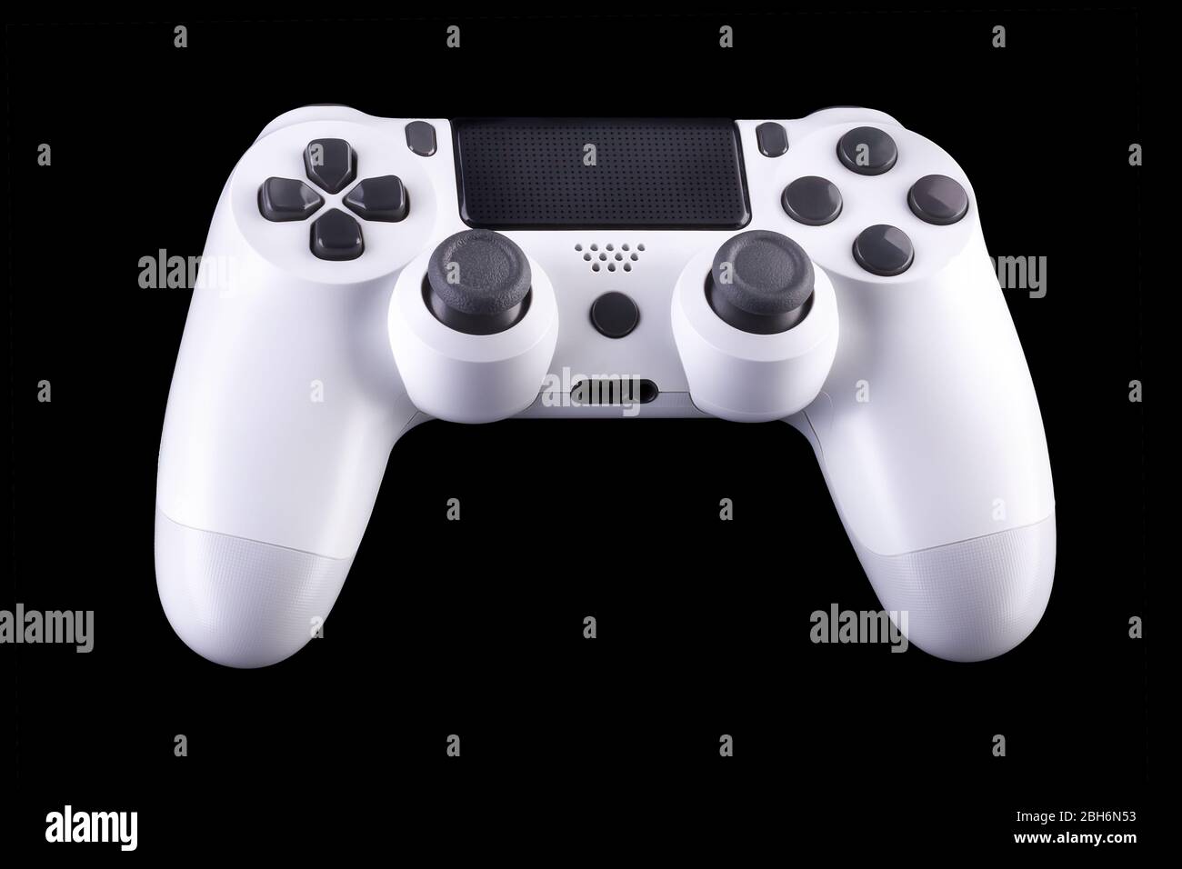 White video game joystick gamepad isolated on a black background with ...