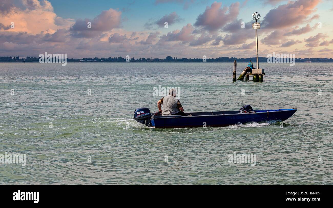 One Man in Motor Boat in Canal Stock Photo - Alamy