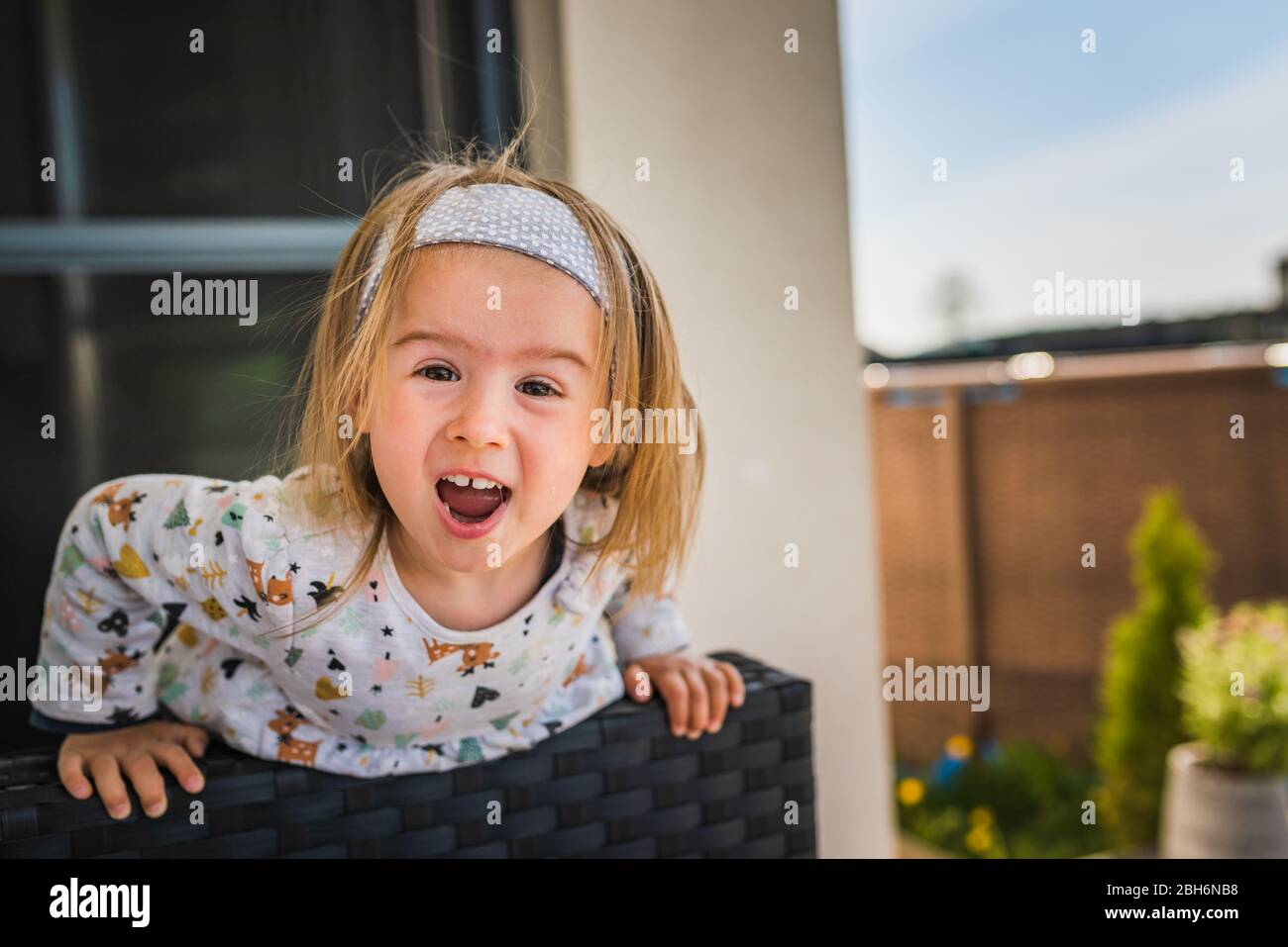 Portrait of very sweet little child with big eyes laughing and ...